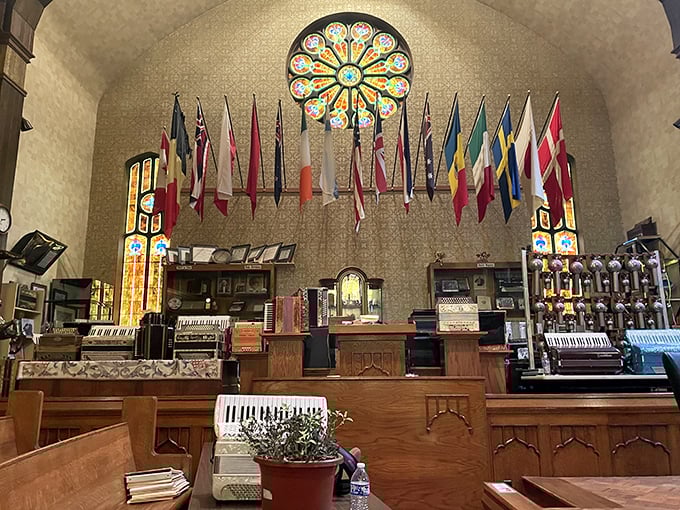 International flags hang proudly in the Hanni Strahl Concert Hall, celebrating the accordion's global journey across cultures and continents.
