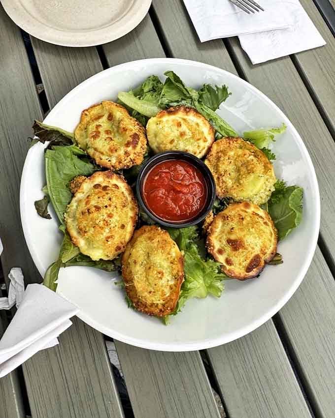 Golden-fried zucchini rounds arrive crispy on the outside, tender within &ndash; the kind of appetizer that disappears so quickly you'll wonder if someone at the next table swiped some.