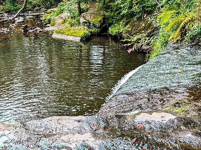 From above, the falls reveal their geometric precision &ndash; nature's architecture at work, designing the perfect cascade over ancient stone.