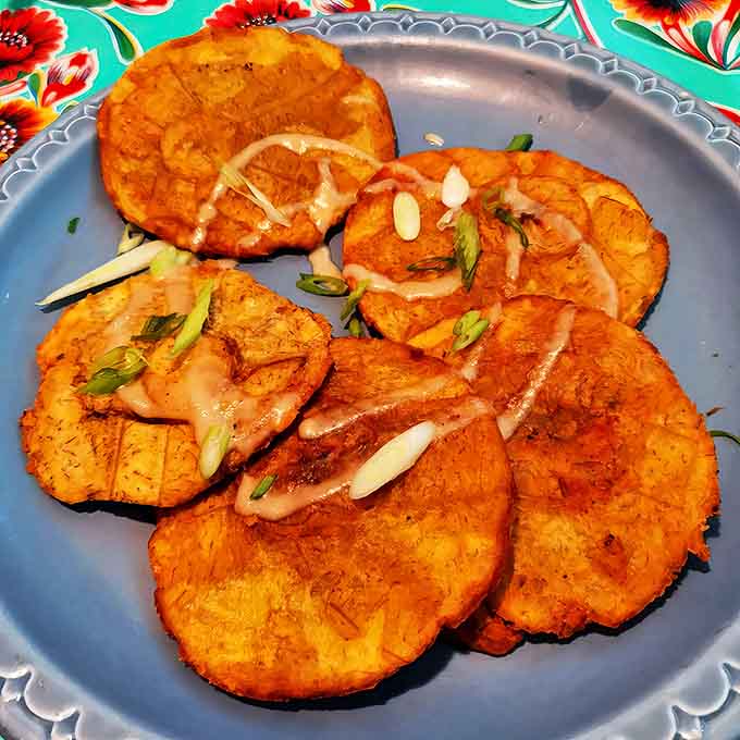 Tostones &ndash; twice-fried plantain discs that achieve the perfect crispy-to-tender ratio, like potato chips that went to finishing school in Havana.