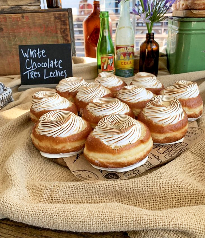 The White Chocolate Tres Leches donuts feature perfectly torched meringue swirls that would make a pastry chef weep with joy.