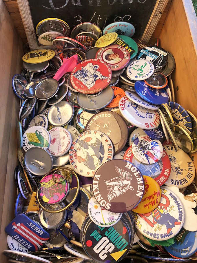 Buttons and pins from bygone eras tell America's story through tiny metal canvases &ndash; political campaigns, local businesses, and cultural moments preserved.