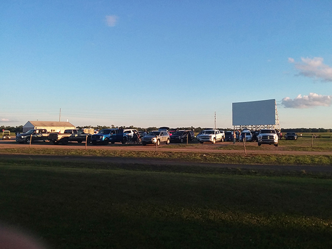 The wide-open lot fills with vehicles of all shapes and sizes, each one a private theater box with the best seats in the house.