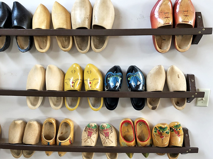 A colorful display of wooden shoes (klompen) showcases Dutch craftsmanship &ndash; practical footwear that became an enduring cultural symbol.