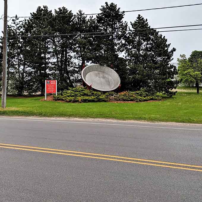 From the roadside, the tilted pan catches the eye of passing motorists, a culinary UFO that's landed among the evergreens.