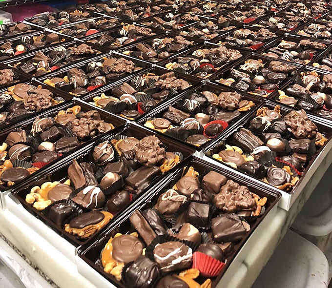 Chocolate heaven in neat rows – each handcrafted piece represents generations of candy-making expertise and pure ingredients.
