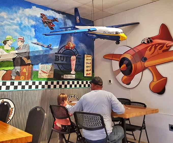 The aviation theme isn't just window dressing &ndash; model planes and vintage-inspired murals create an immersive dining experience that's truly uplifting.