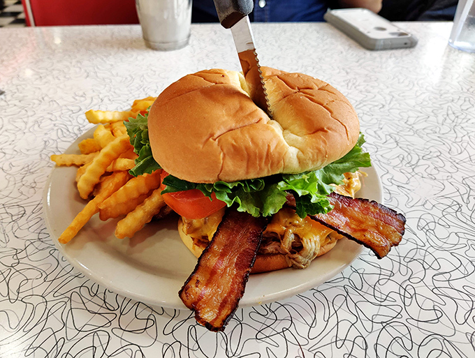 A burger that doesn't need fancy aiolis or artisanal buns to impress &ndash; just honest beef and perfectly crisp bacon.