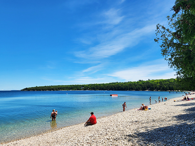 Summer bliss: Visitors find their perfect spots along the shoreline, each creating their own island memories.