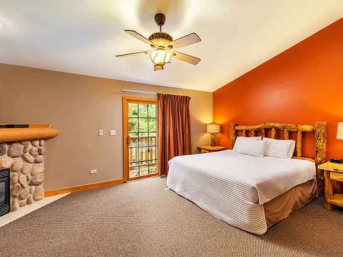 After a day of aquatic adventures, retreat to a cozy bedroom that continues the woodland theme with rustic touches and earth tones.