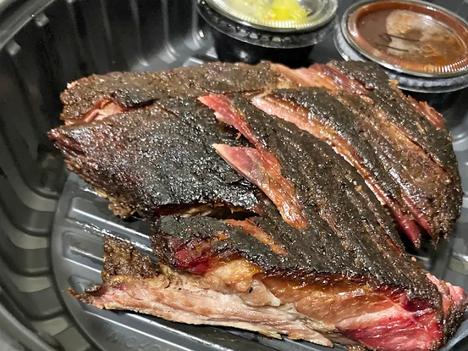 Brisket that tells the story of patience &ndash; a deep smoke ring, rendered fat, and bark that delivers flavor in every magnificent bite.