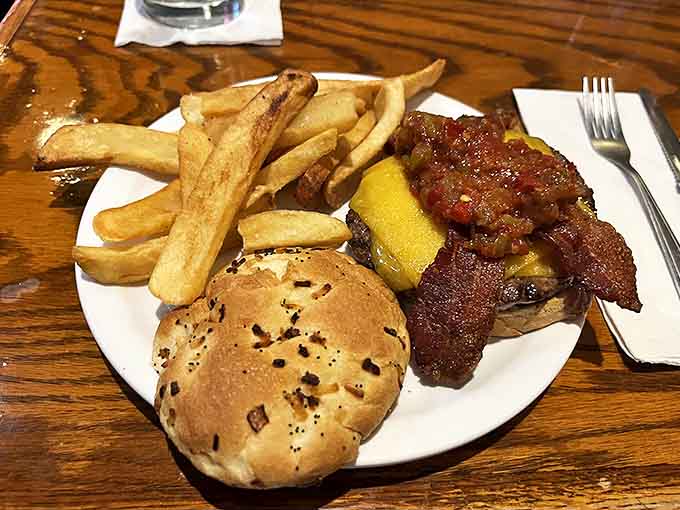 The bacon cheeseburger arrives like edible architecture &ndash; layers of smoky, crispy bacon and melted cheese creating flavor harmony that's borderline symphonic.