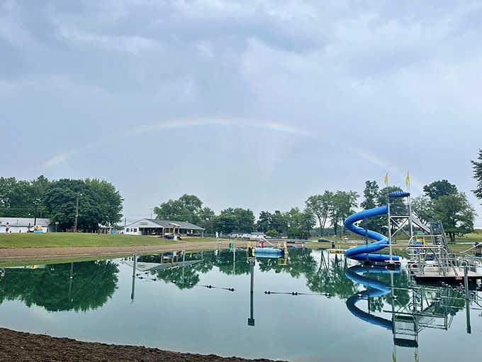 A perfect summer day captured in one frame – blue water, blue skies, and the iconic blue slide waiting for adventurous spirits.