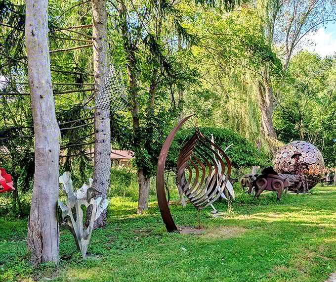 A metallic figure clutches a bright red guitar, frozen mid-performance as if waiting for visitors to provide the missing melody.