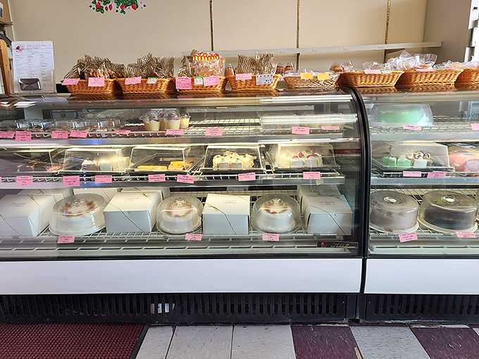 Sweet decisions await at the display case, where cakes, pastries, and other delights compete for your attention and affection.
