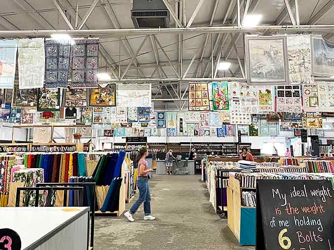Completed projects hang from the ceiling, offering inspiration and a glimpse of what your fabric might become with patience and skill.