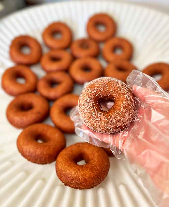 Each donut, a perfect circle of happiness, hand-crafted and sugar-dusted &ndash; simplicity that somehow tastes like childhood memories.