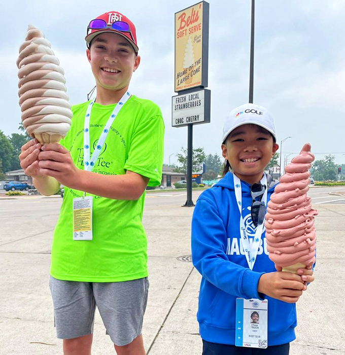 Young ice cream warriors proudly display their trophy cones, creating childhood memories that will last far longer than the treats themselves.