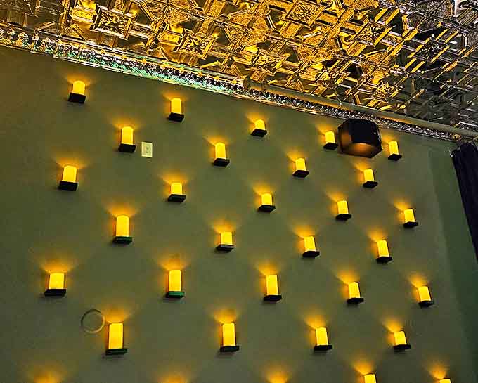 Warm golden sconces create atmosphere &ndash; These wall-mounted lights cast a honeyed glow across the room, their gentle illumination flattering every face in the house.