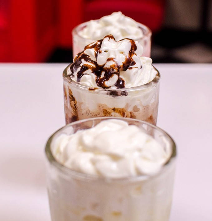 Decisions, decisions – these milkshakes stand at attention, ready to transport your taste buds to a simpler, sweeter time.