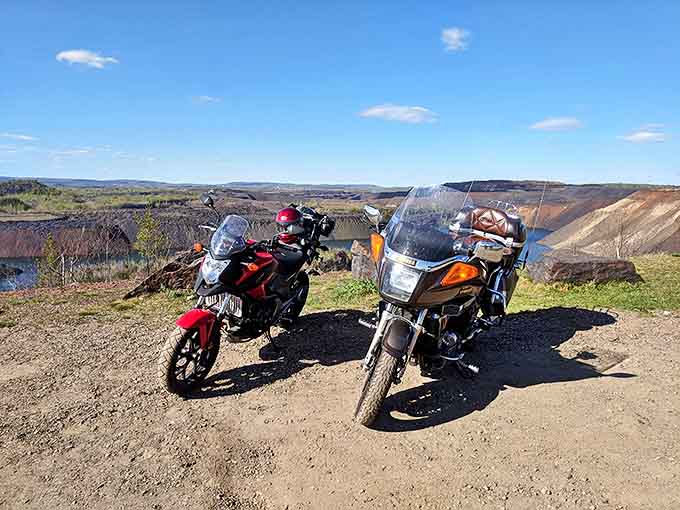 Adventure machines taking a breather at the overlook – even motorcycles seem to pause in appreciation of the view.