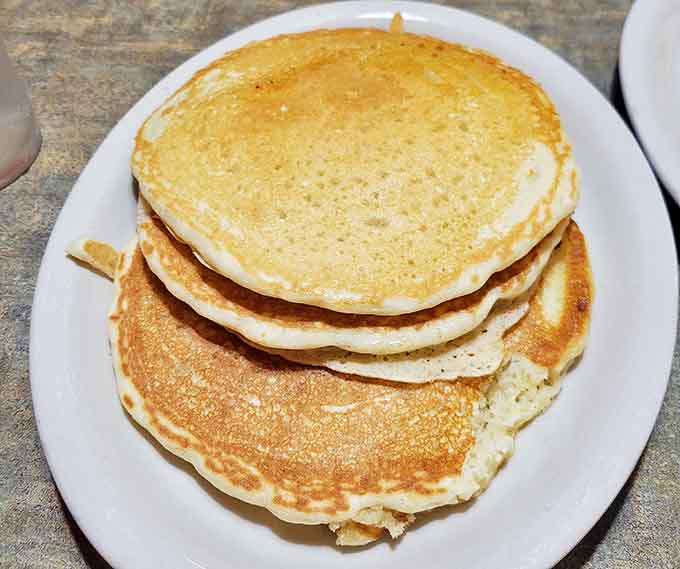 These pancakes don't just sit on the plate &ndash; they stand tall with pride, golden-brown and ready to soak up rivers of maple syrup.