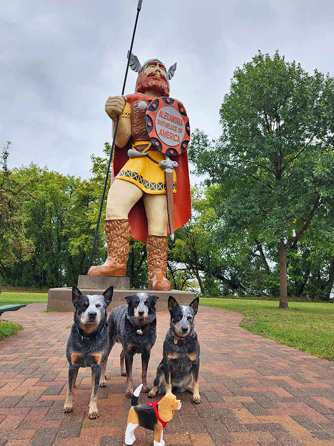Even the local four-legged residents seem to appreciate Big Ole's protective presence, gathering at his feet like tiny furry Vikings ready for adventure.
