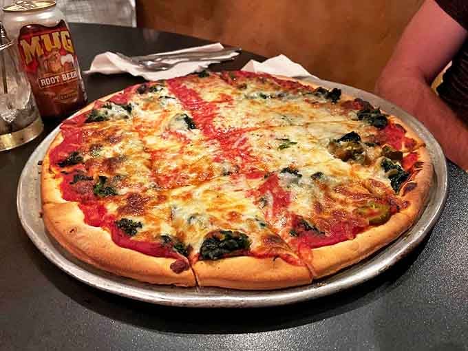 Pizza perfection with a crust that hits the sweet spot between crisp and chewy &ndash; this spinach-topped beauty proves vegetables can be indulgent too.