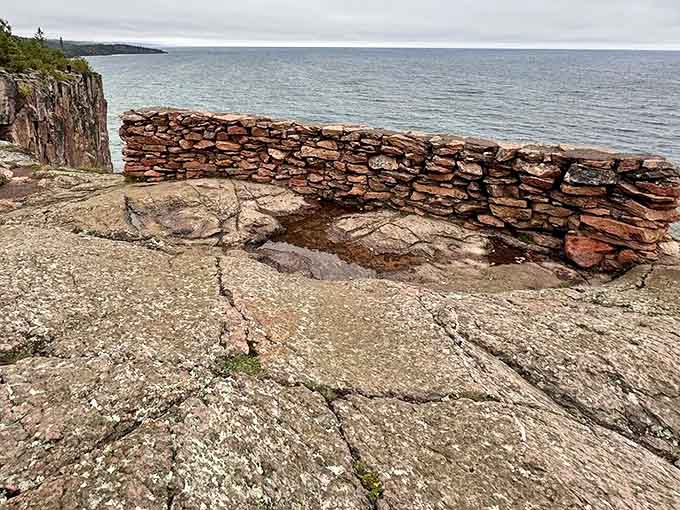 This historic stone wall isn't just for safety&mdash;it's a front-row seat to one of nature's most spectacular shows on Lake Superior.
