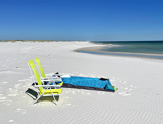 The perfect beach equation: one empty chair plus endless horizon equals the stress-melting therapy session you desperately needed.