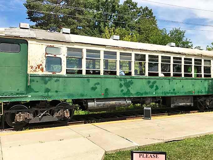 The green passenger car might not offer Wi-Fi or reclining seats, but it delivers something better: authentic railroad heritage with a side of nostalgia.