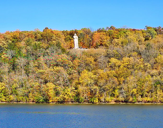 From across the Rock River, the statue appears to emerge from the treetops like a mythical forest guardian keeping watch over the valley.