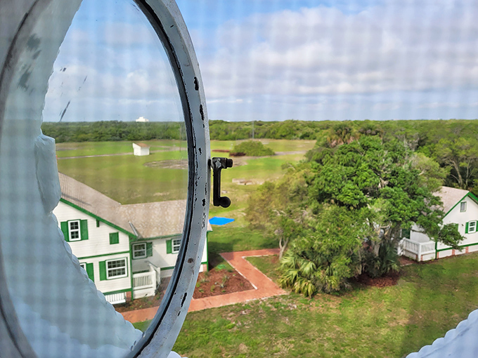 Peek through this porthole window for a keeper's view of the grounds, framing the historic cottage in a perfect maritime circle.