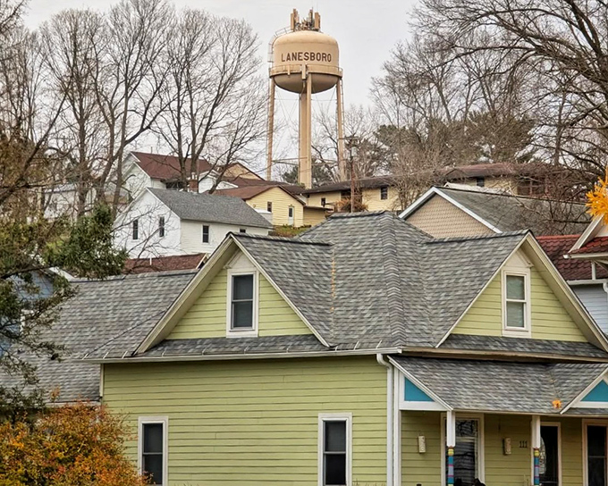 The water tower stands watch over residential streets where neighbors still know each other's names and probably their business too.