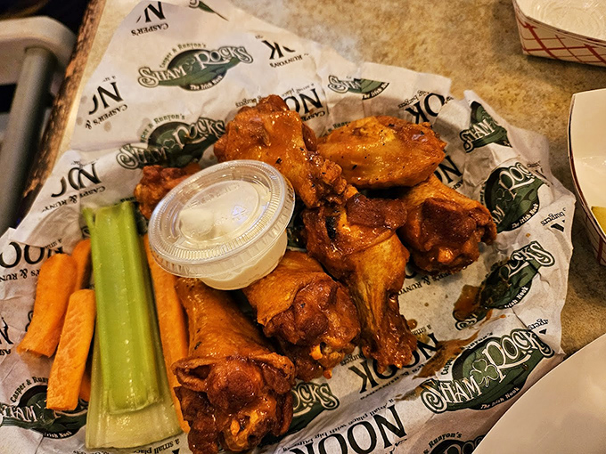 Wings that don't play second fiddle to the burgers - crispy, saucy, and served with the traditional celery and carrot accompaniments.