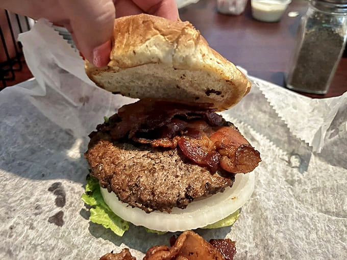 Bacon Burger: The architecture of indulgence &ndash; notice how the bacon peeks out, promising smoky crispness with each magnificent bite.