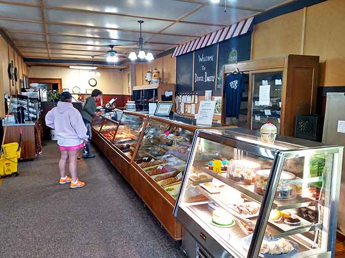 The morning ritual unfolds as customers contemplate life's most important decision: which heavenly creation will accompany their coffee today?