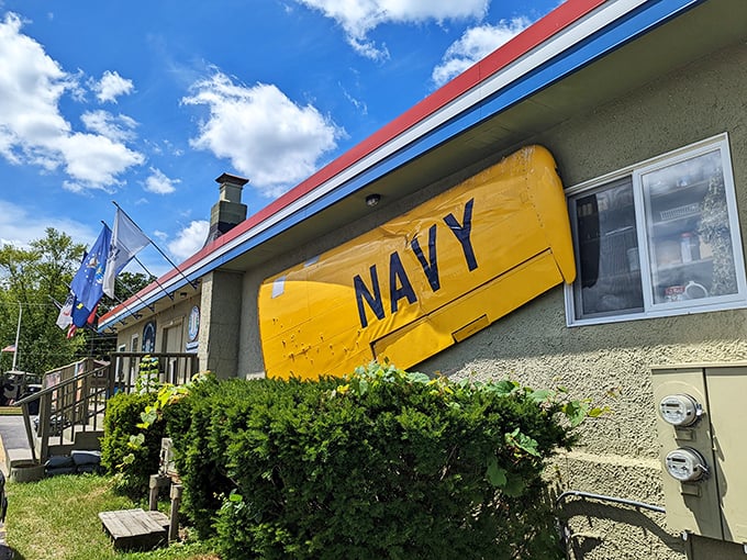 Patriotic dining! The Bunker's exterior features authentic military artifacts, including this yellow "NAVY" aircraft part.