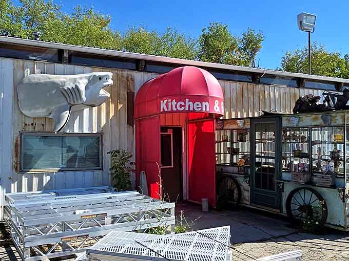 A giant shark head juts from the side of this quirky roadside shop, just one of many bizarre treasures at M Schettl Sales.