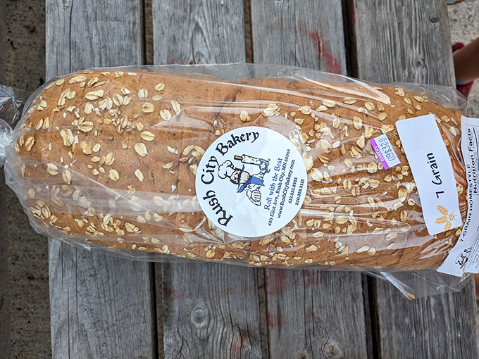 Hearty oatmeal bread packaged and ready to take home, perfect for tomorrow's breakfast toast or sandwiches.