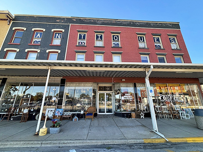 "ANTIQUES" &ndash; the siren call of collectors everywhere, displayed proudly on this vintage storefront that's practically an antique itself.