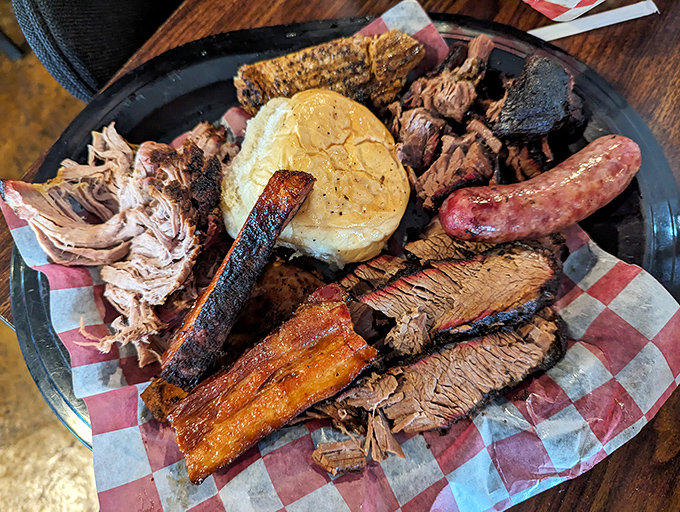 This barbecue platter isn't just a meal, it's a celebration featuring a greatest hits album of smoked meats and homestyle sides.