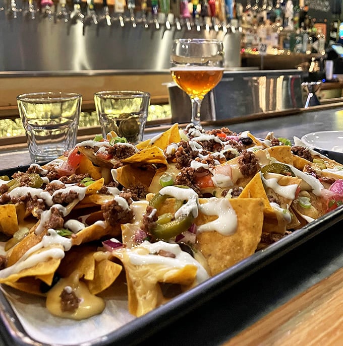Loaded nachos that maintain structural integrity until the very last bite &ndash; an architectural achievement topped with melty goodness.