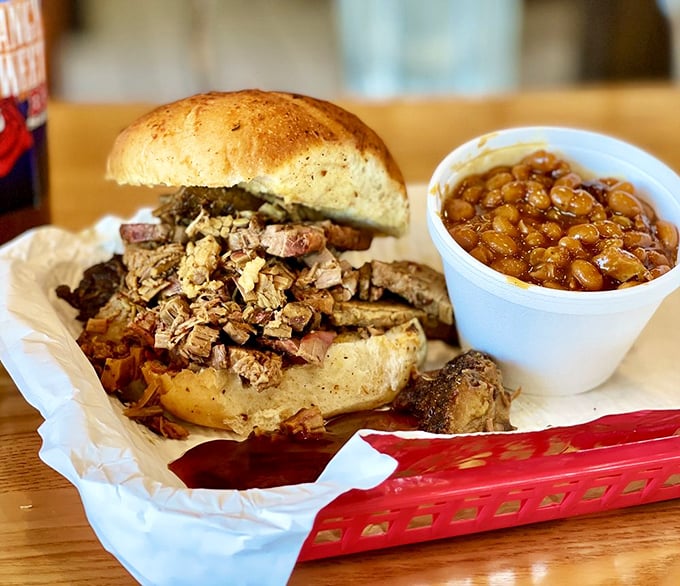 A brisket sandwich stacked this high requires structural engineering skills to eat, but nobody's complaining about that delicious architectural challenge.