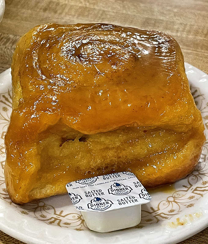 This caramel roll comes with a pat of salted butter, creating that perfect sweet-salty balance that makes taste buds sing.