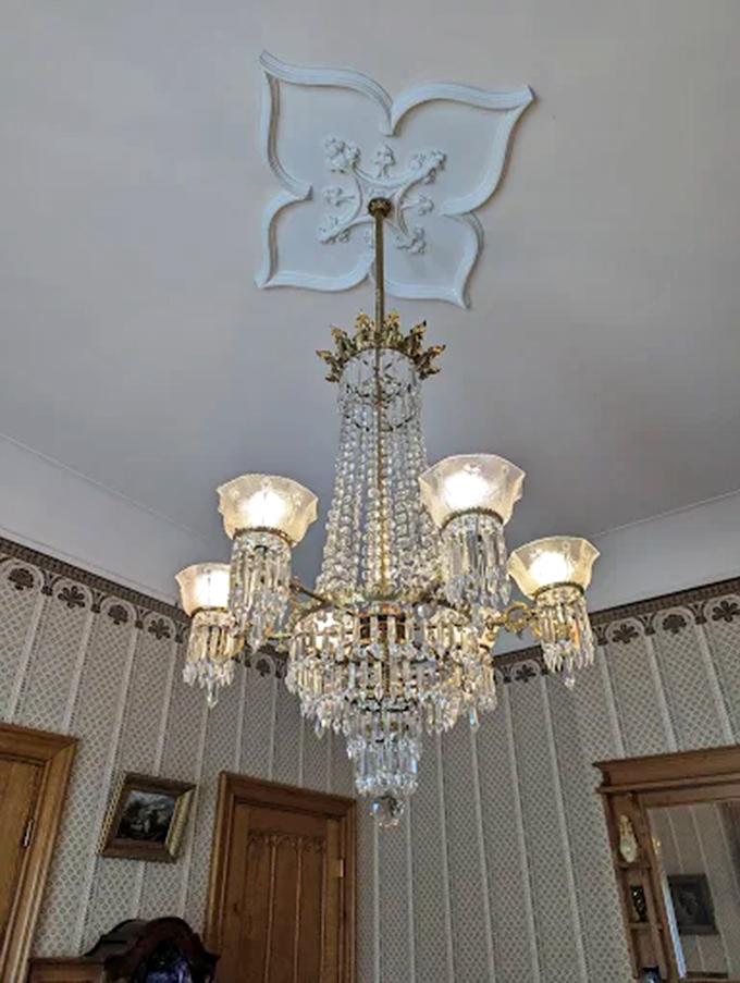 Crystal, brass, and Victorian craftsmanship combine in this showstopping chandelier. Imagine the dinner conversations it illuminated before electricity was even a thing.