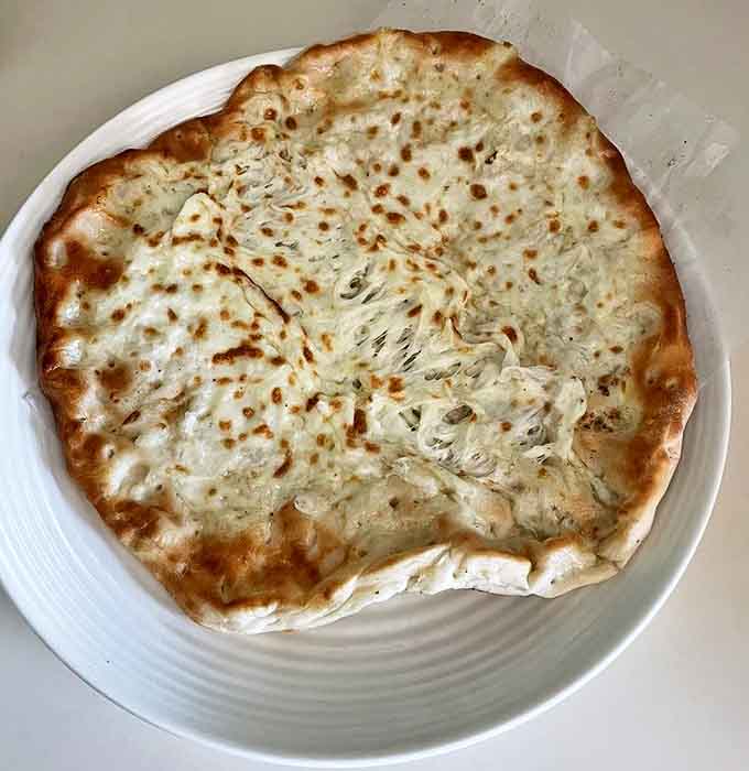 Cheese manakeesh: where stretchy, melty cheese meets perfectly baked flatbread in a relationship that was clearly meant to be.