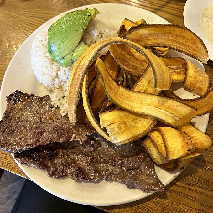 Grilled steak with the perfect char, accompanied by white rice and avocado &ndash; simple ingredients elevated to extraordinary heights.