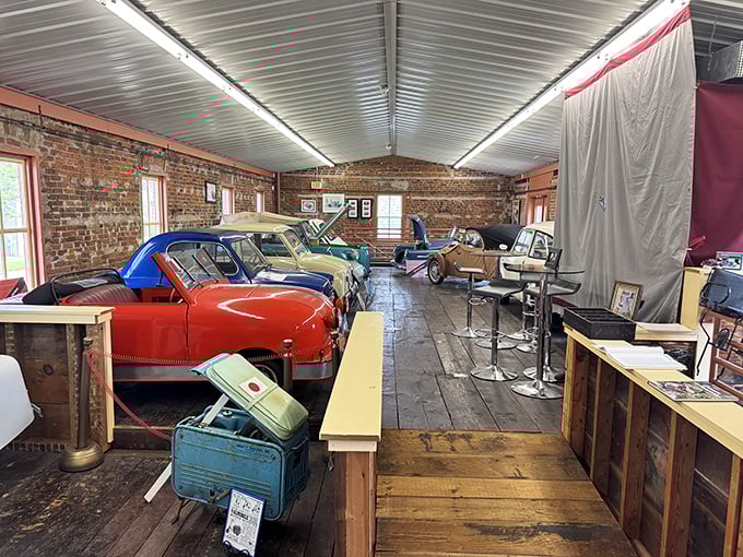 A rainbow of tiny automotive treasures lines this rustic gallery, where weathered wooden floors and exposed brick walls showcase these pint-sized road warriors in their natural habitat.