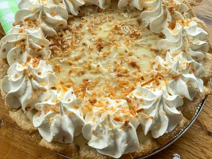 Behold the coconut cream masterpiece! Those perfectly piped whipped cream peaks and toasted coconut flakes are the dessert equivalent of a standing ovation.